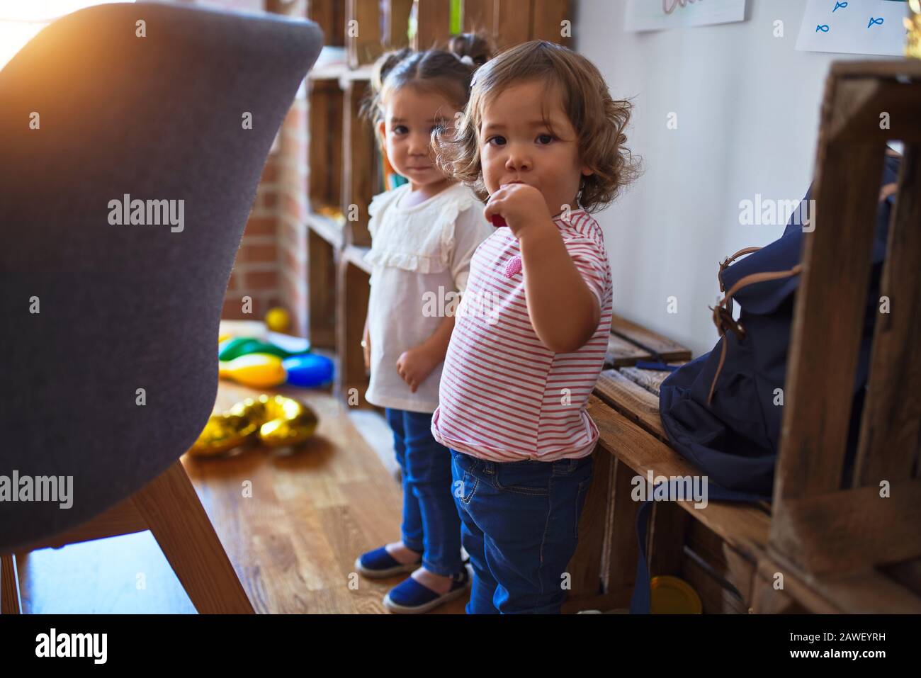 Adorable toddlers standing at kindergarten Stock Photo - Alamy