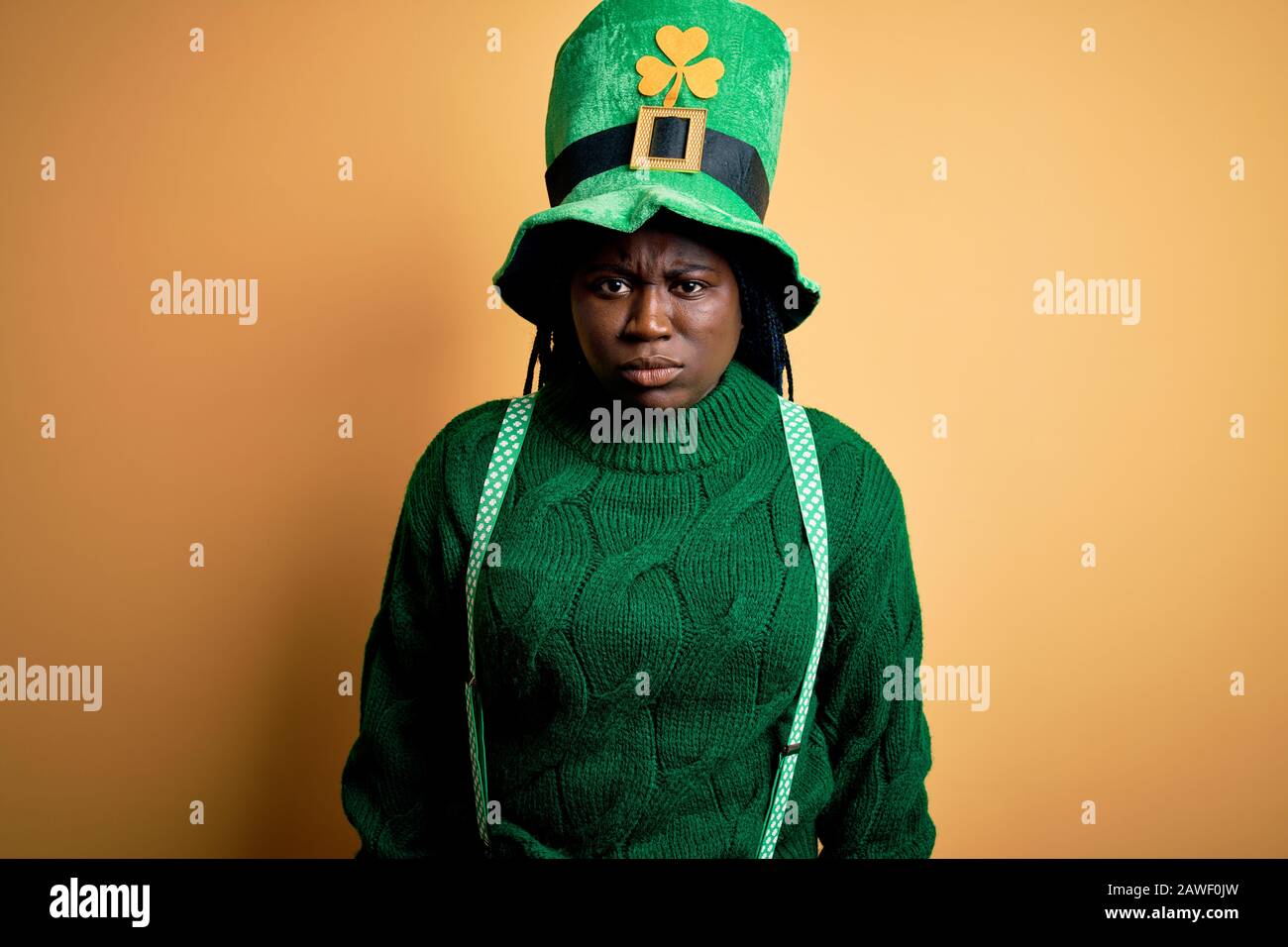 Plus size african american woman with braids wearing green hat with ...