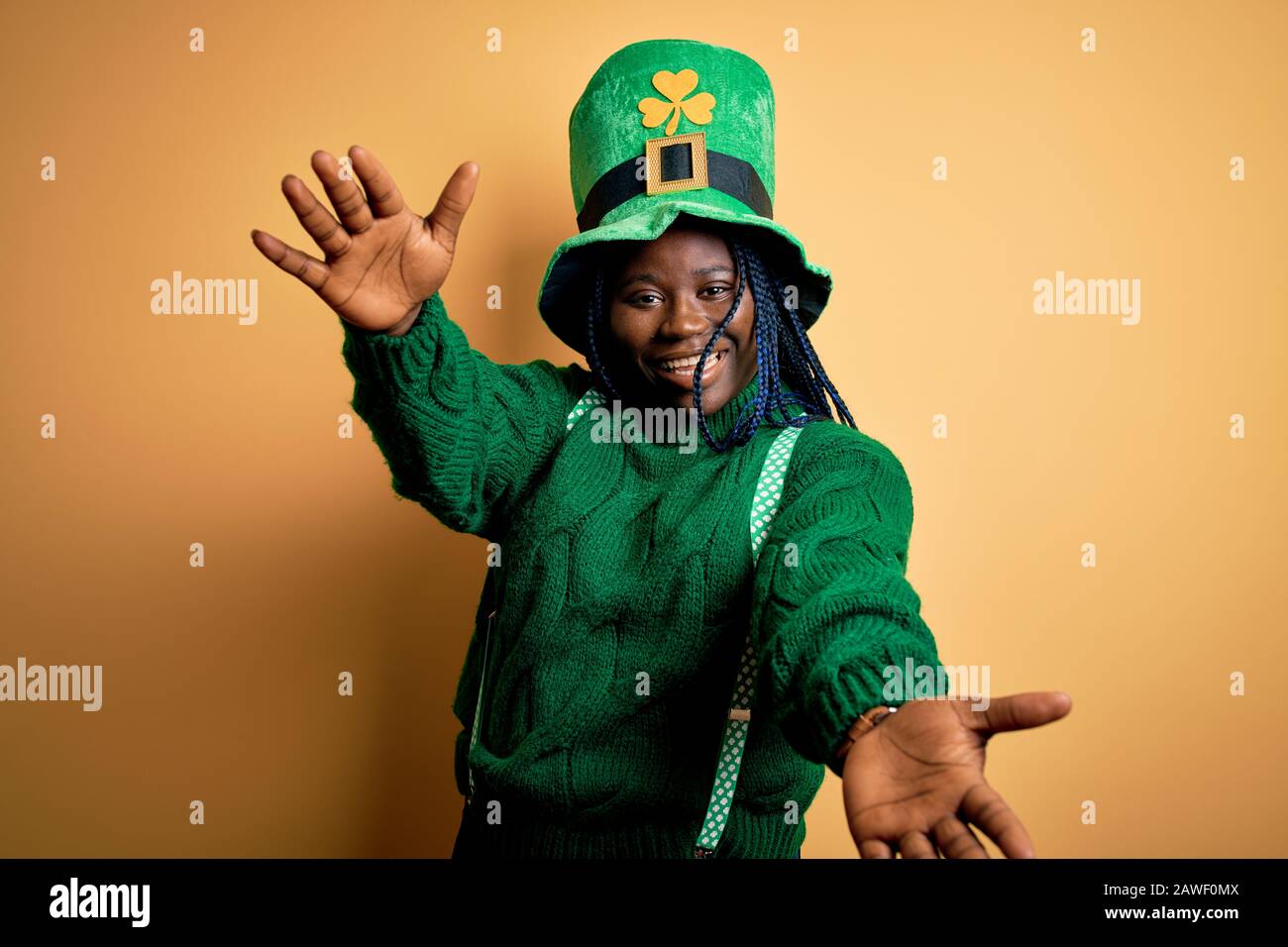 Plus size african american woman with braids wearing green hat with ...