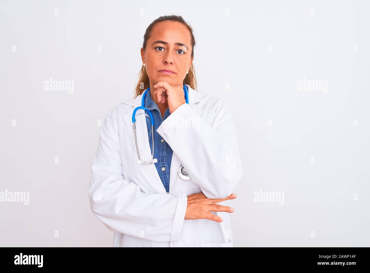 Middle age mature doctor woman wearing stethoscope over isolated ...