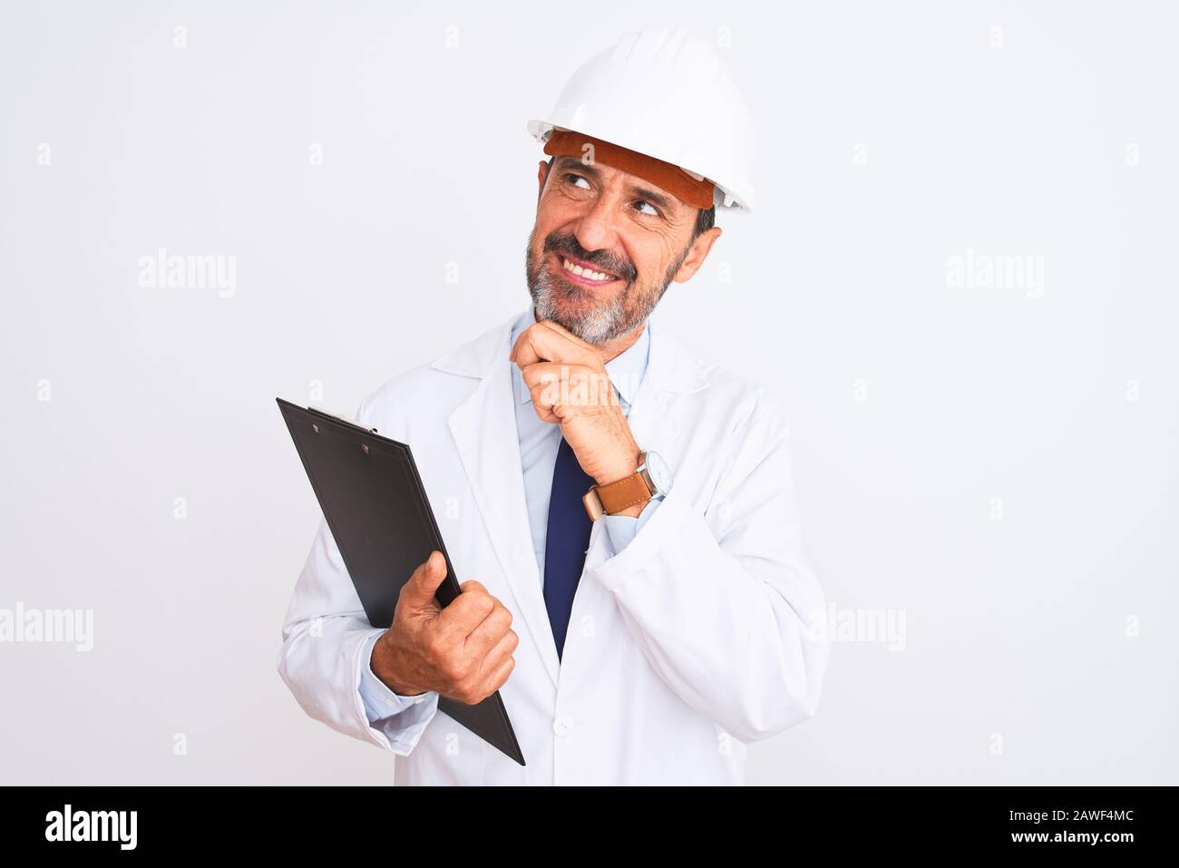 Senior engineer man wearing security helmet holding clipboard over ...