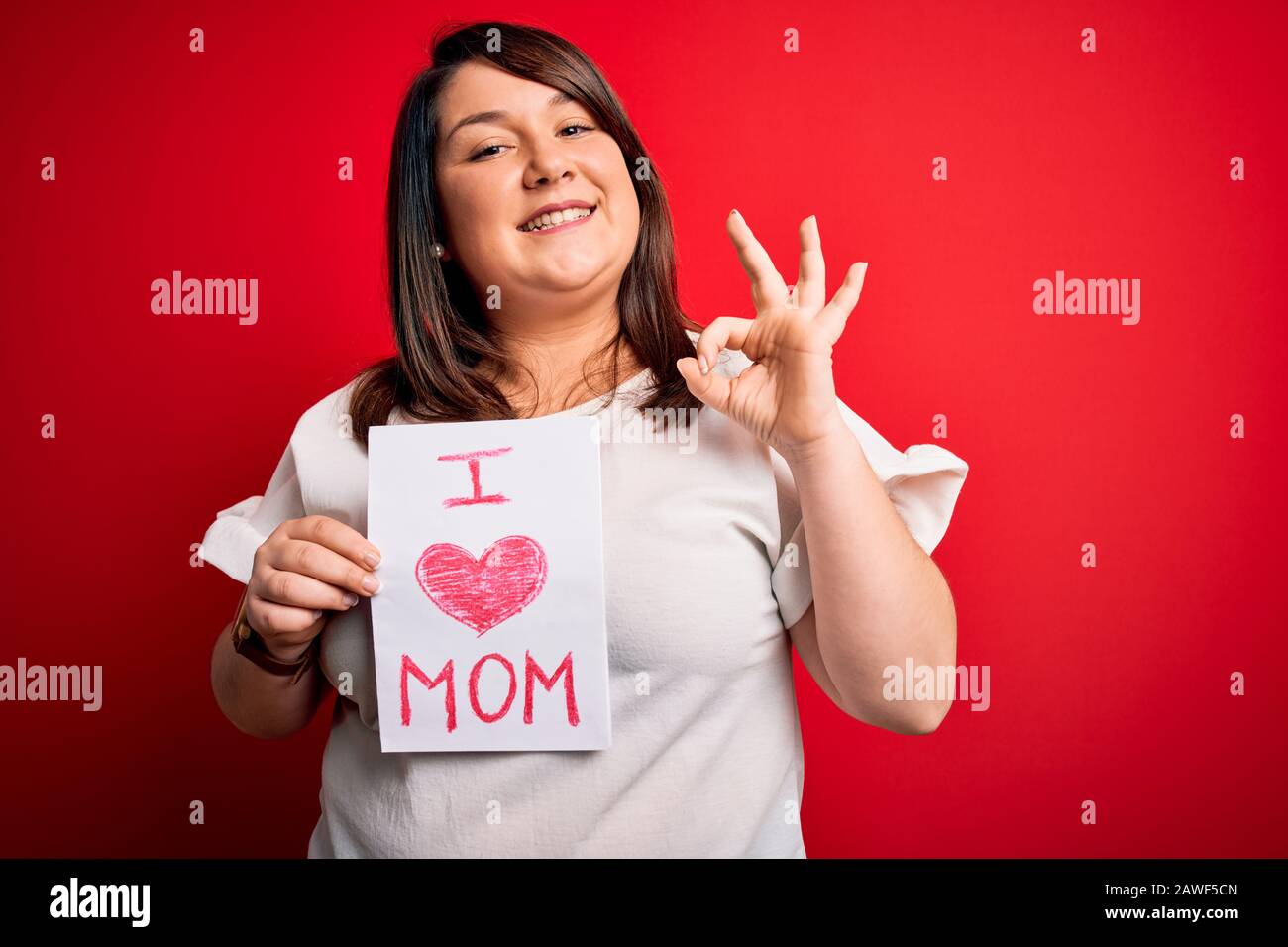 Beautiful brunette plus size woman holding love mom message celebrating ...