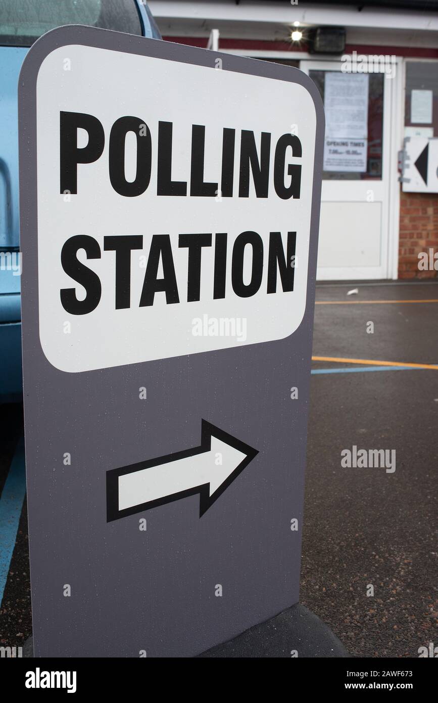 Large free standing POLLING STATION sign in a wet school playground ...
