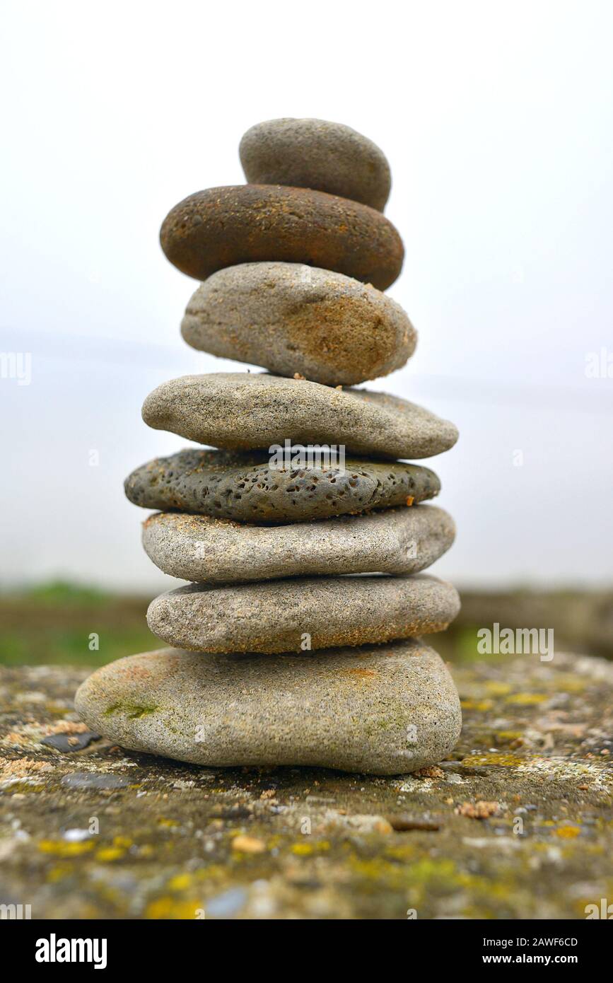 Stack on beach stones, piled one on top of another in their natural ...