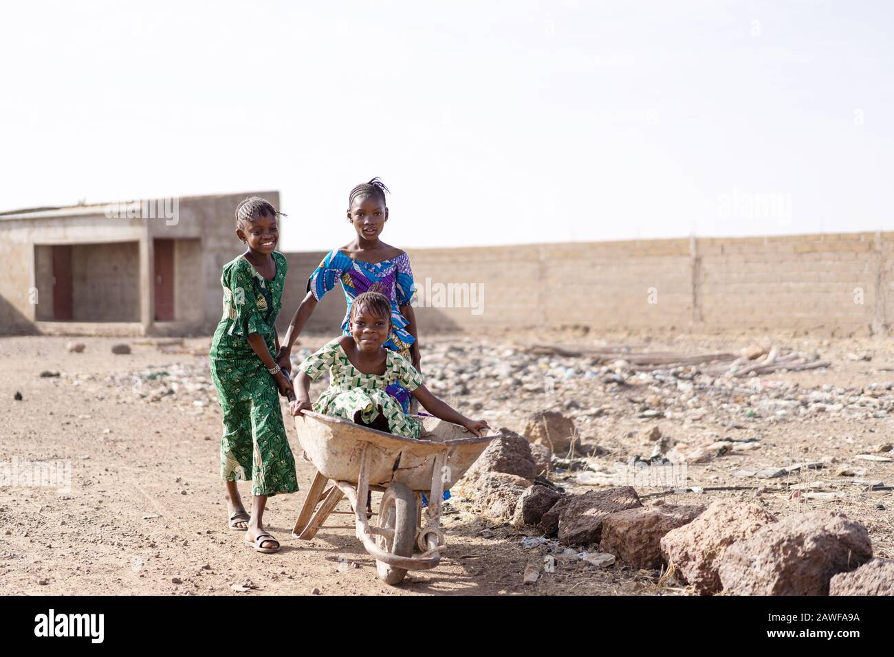 Real African Young Girl Gathering Fresh Water for an aridity concept ...