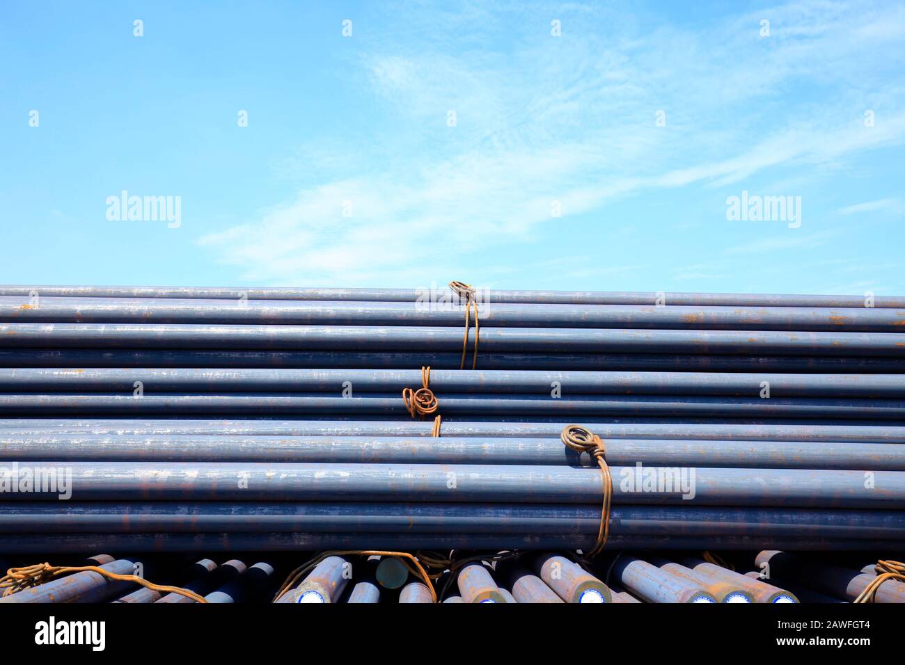 Stack of round steel bar Stock Photo - Alamy