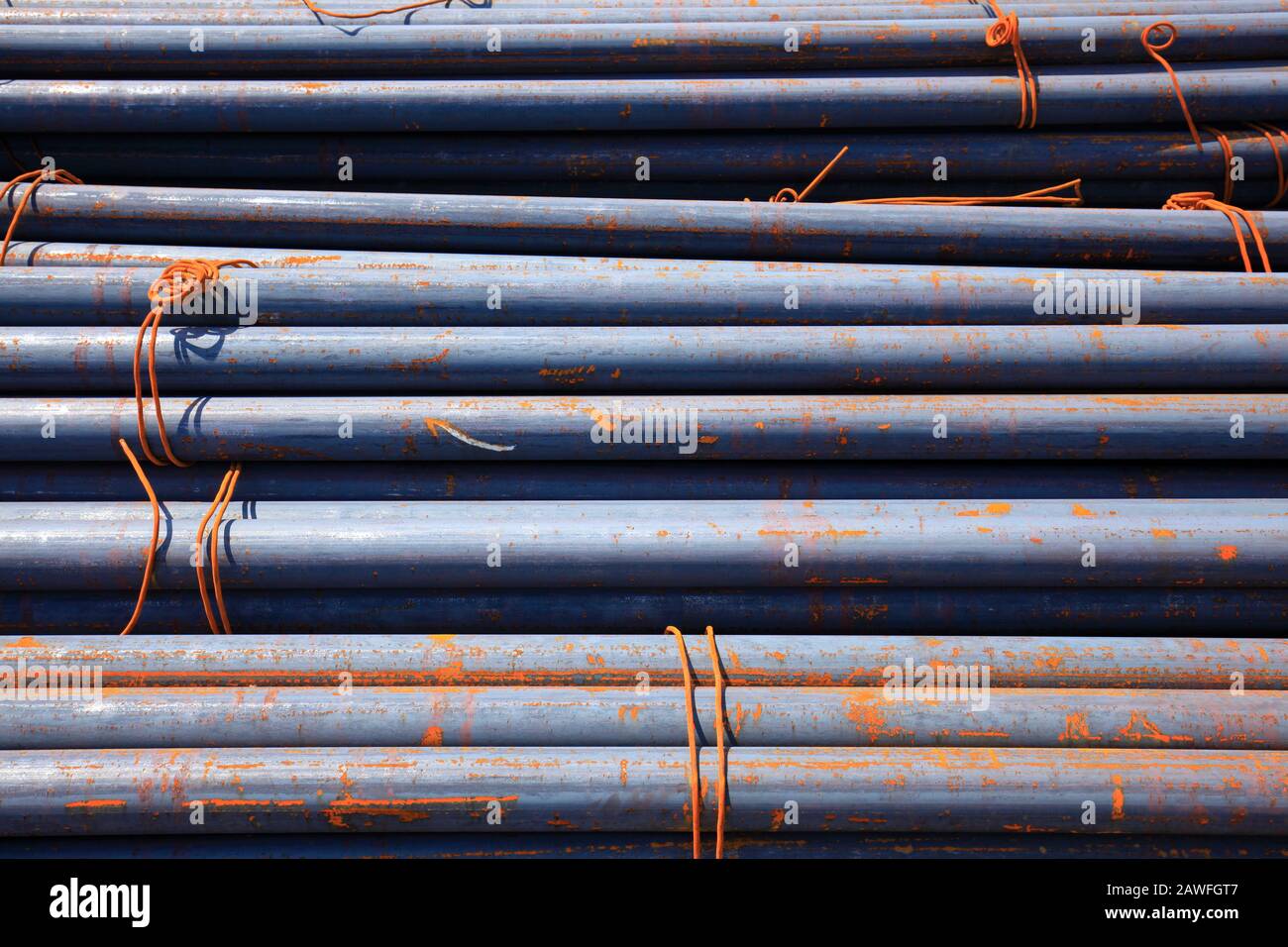 Stack of round steel bar Stock Photo - Alamy