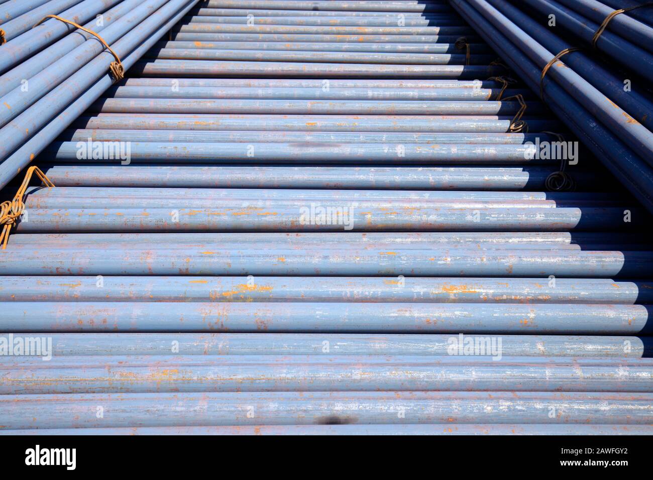 Stack of round steel bar Stock Photo - Alamy