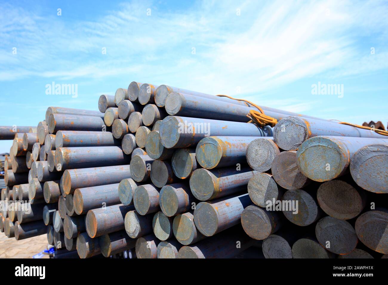Stack of round steel bar Stock Photo - Alamy