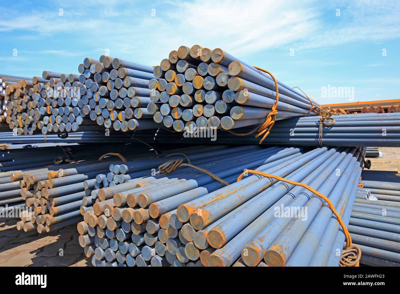 Stack of round steel bar Stock Photo - Alamy