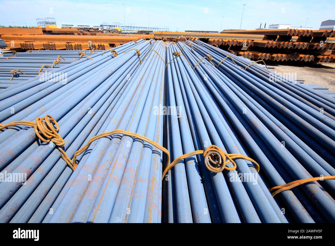 Stack of round steel bar Stock Photo - Alamy