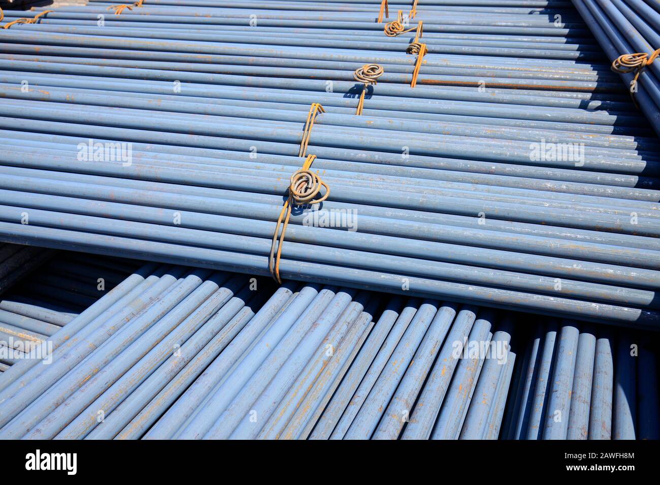 Stack of round steel bar Stock Photo - Alamy