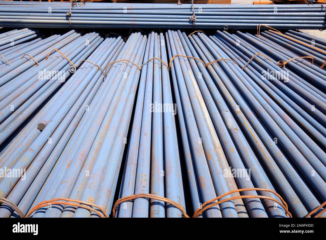 Stack of round steel bar Stock Photo - Alamy