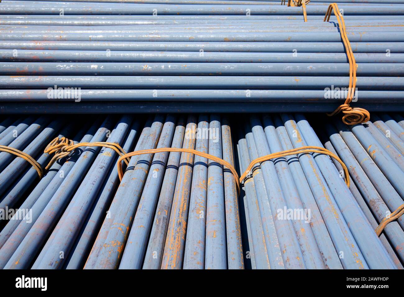 Stack of round steel bar Stock Photo - Alamy