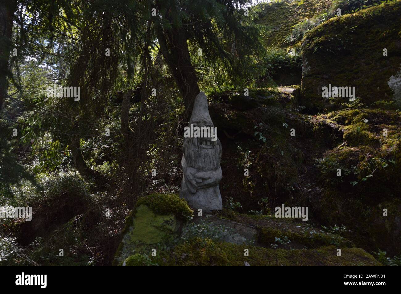 Forest, rock mountain, statue Stock Photo - Alamy