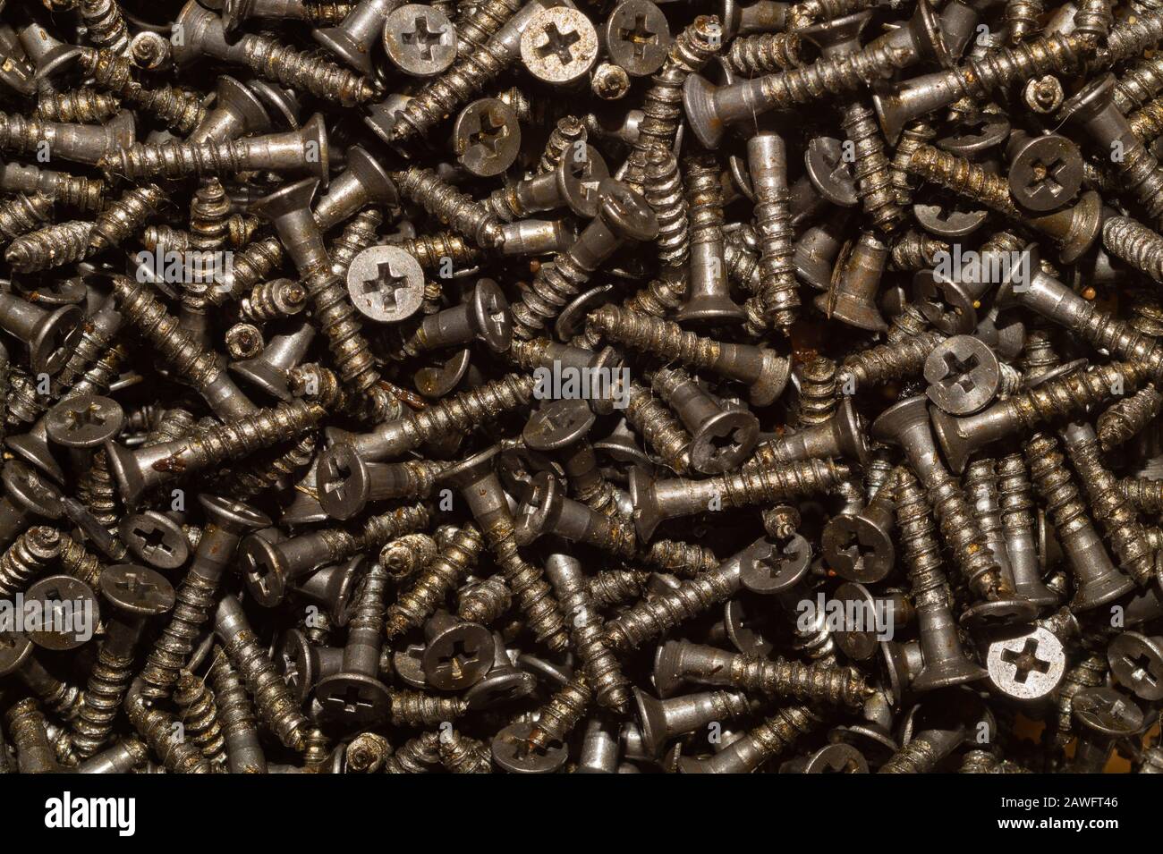 Screws background. heap of tapping screws. work tool. pile of fasteners ...