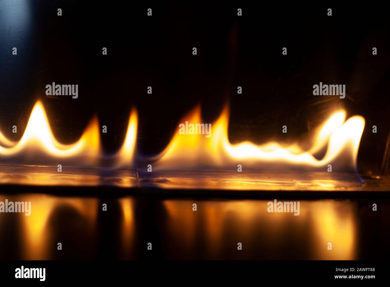 Fiery background. Flames of fire in the dark. Flame texture. Tongues of ...