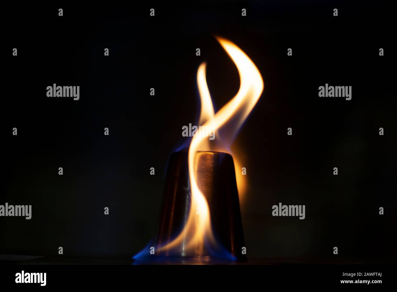 Alcohol burns on a stack for alcoholic drinks. Tongues of flame around ...