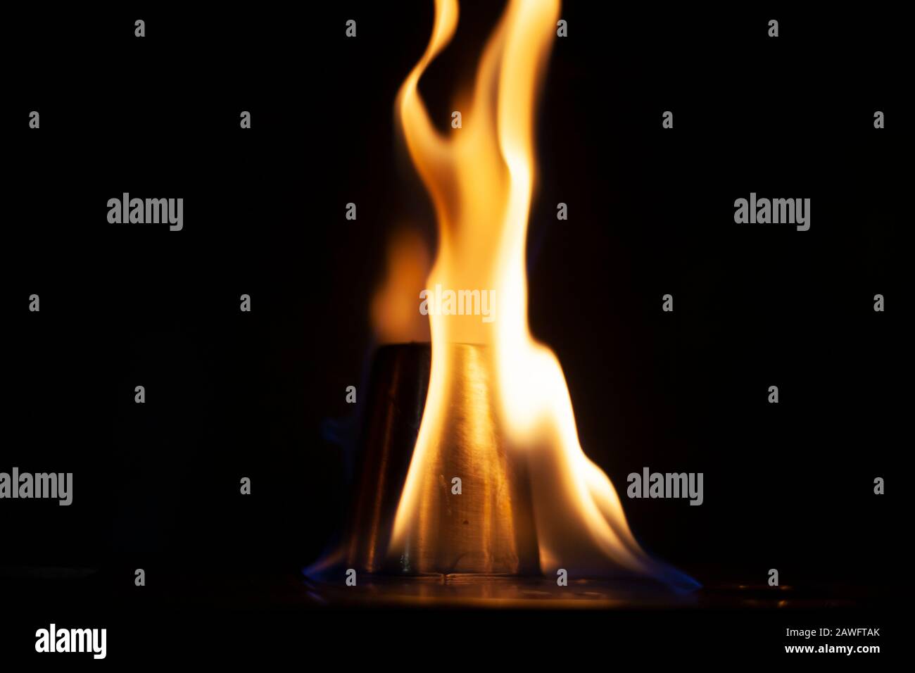 Alcohol burns on a stack for alcoholic drinks. Tongues of flame around ...