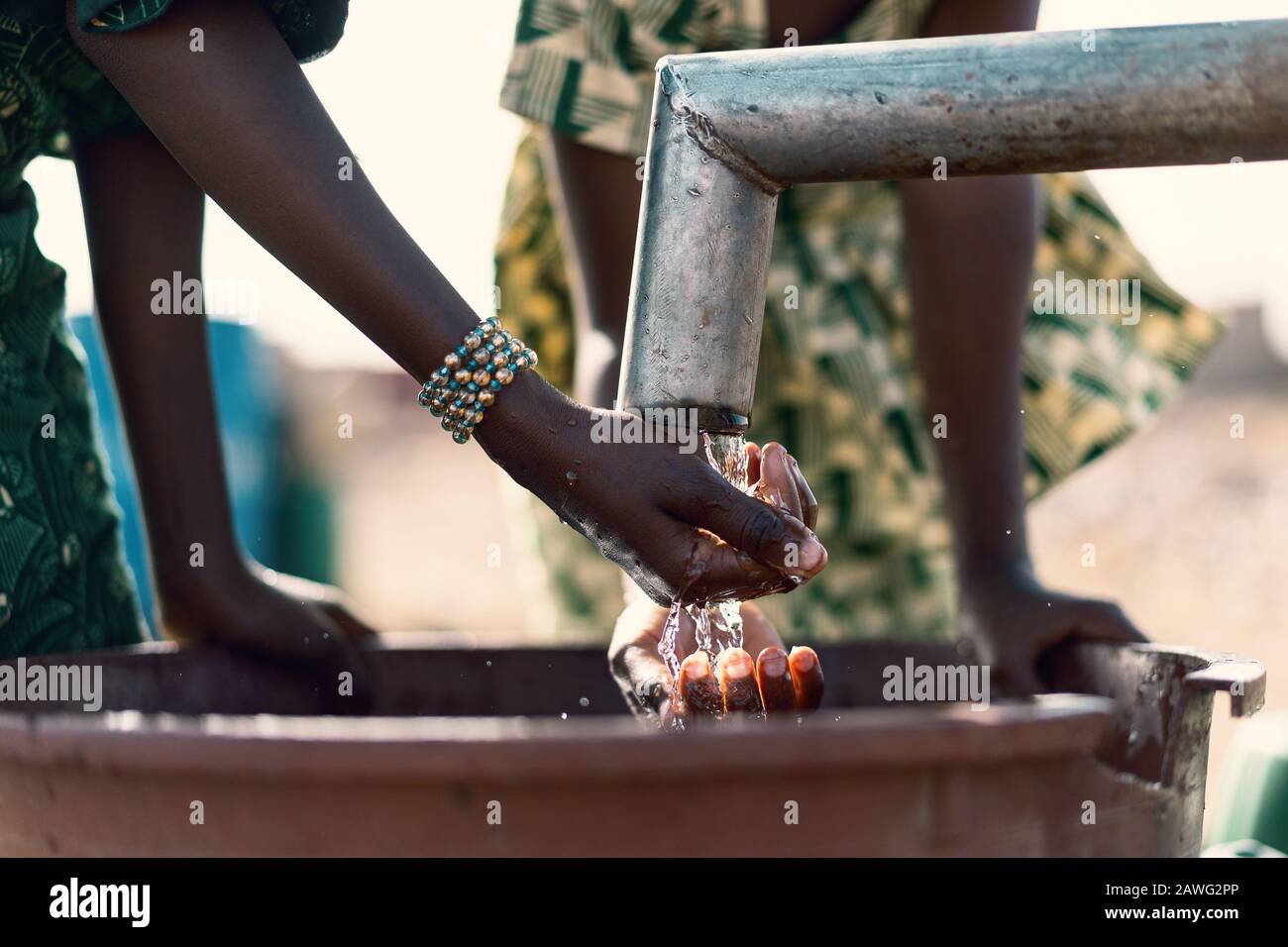 Happy African Girl Collecting Healthy Water with major difficulties ...