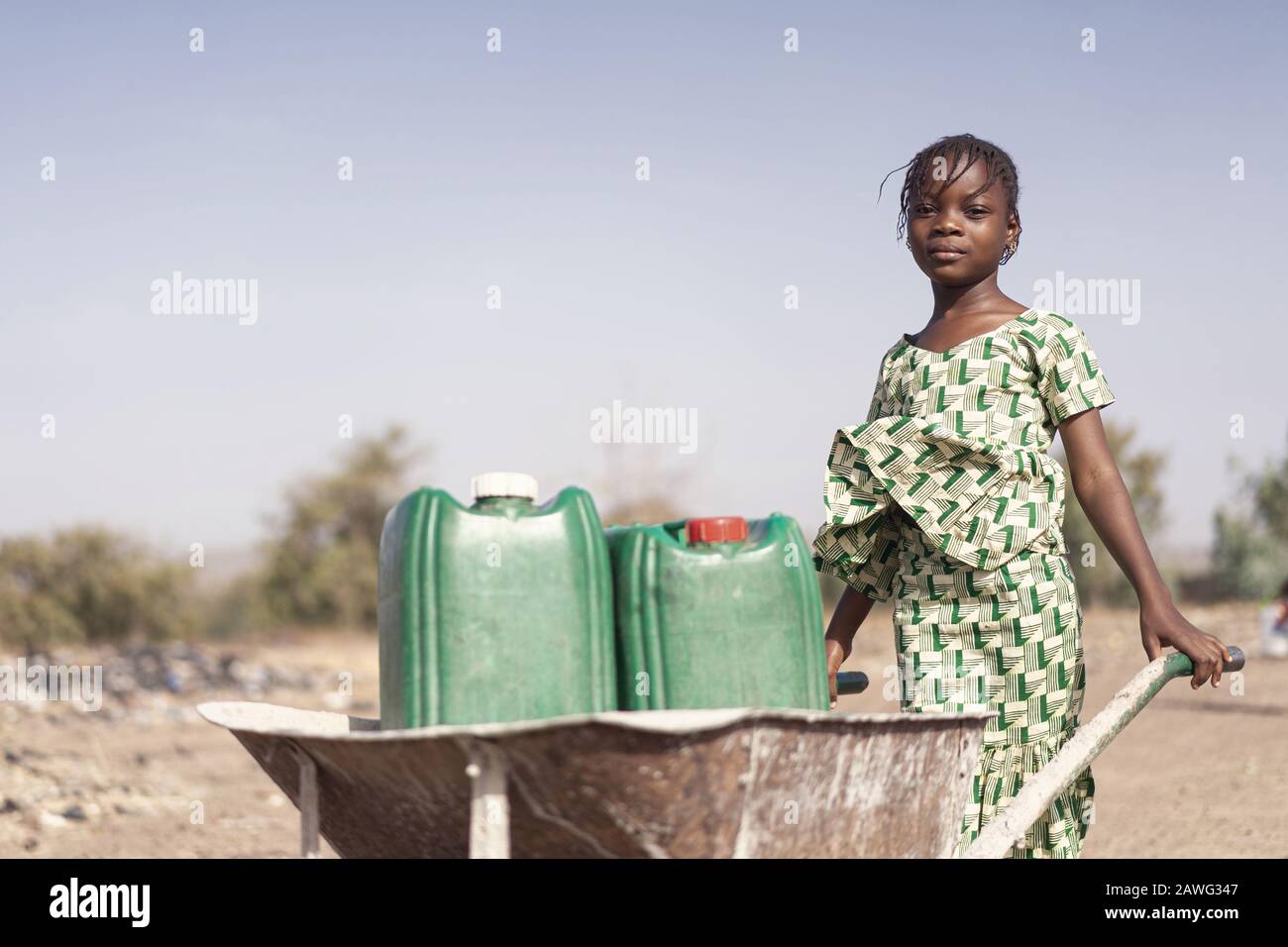 Little Indigenous Girl getting Tap Water with major difficulties Stock ...