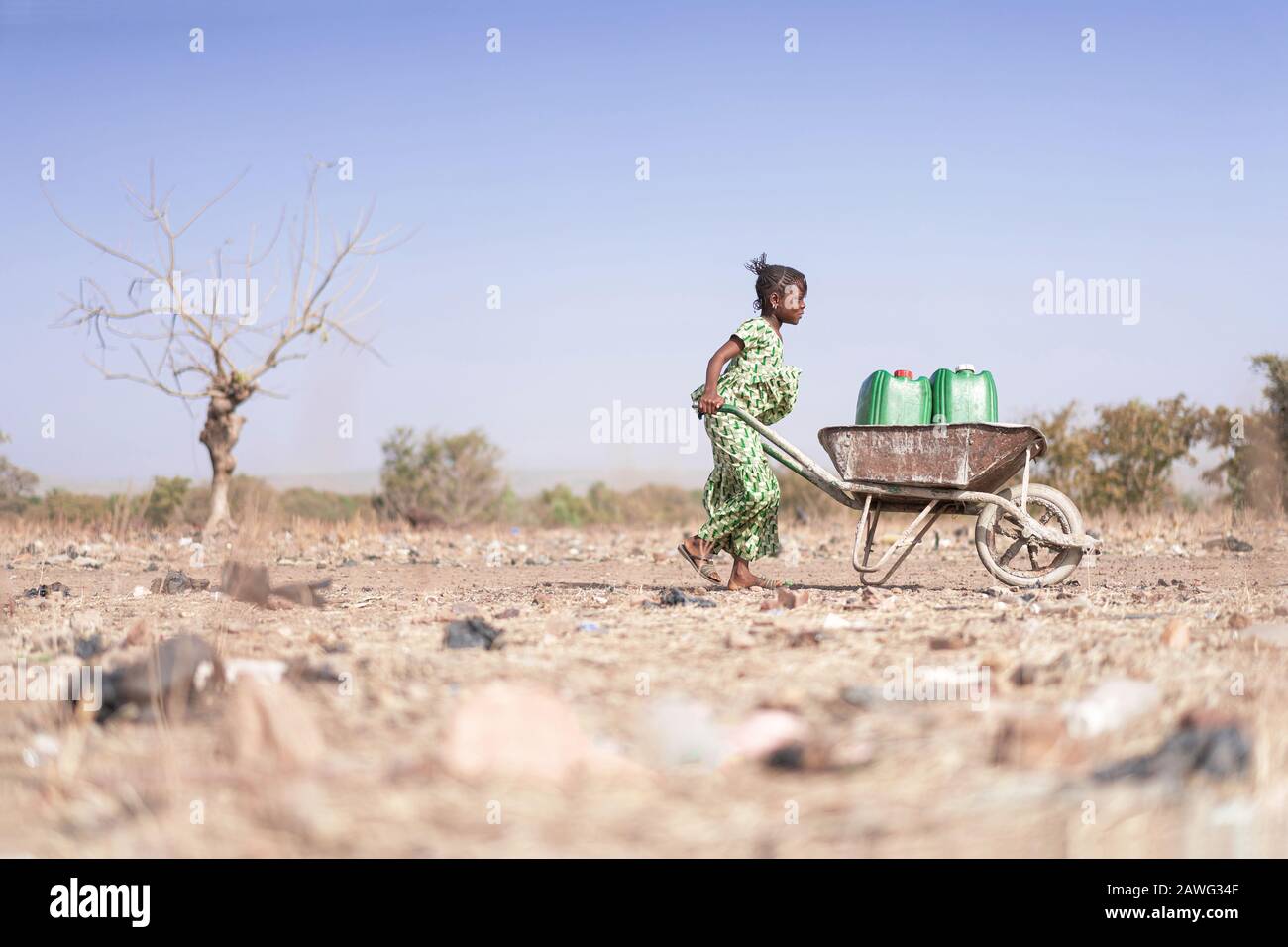 Girl Pouring Water African High Resolution Stock Photography and Images ...