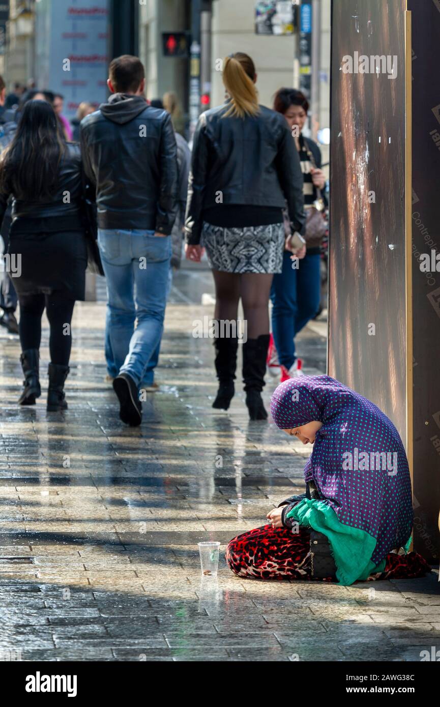 Beggar on the sidewalk at Champs-Elysees in Paris Stock Photo - Alamy