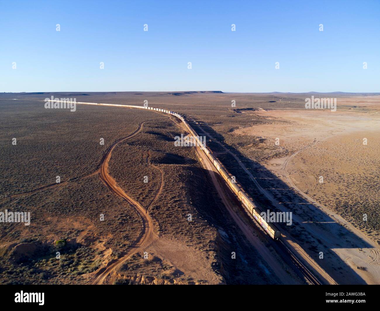 Aerial of intermodal double decker container freight train leaving Port ...