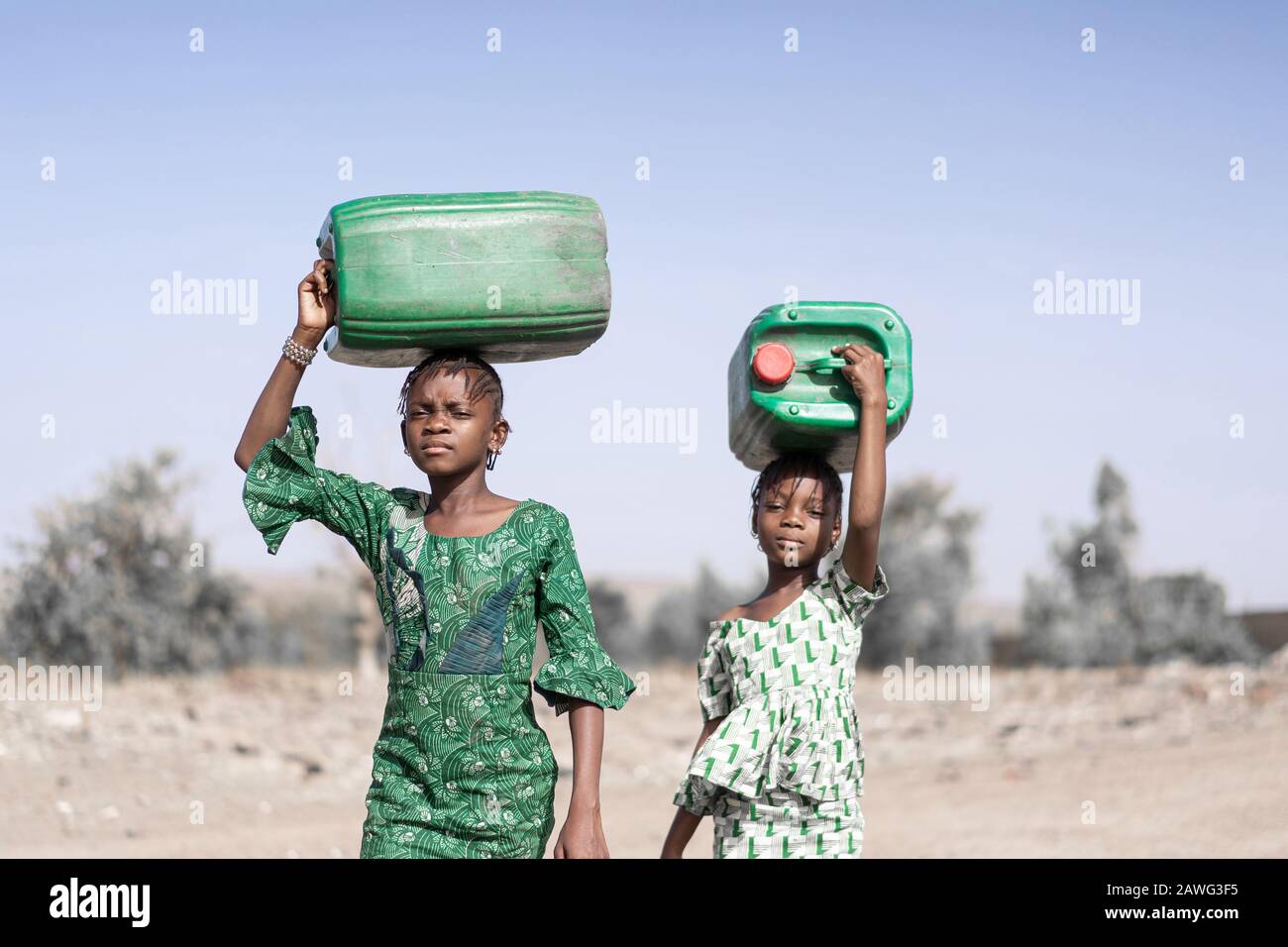 Working African Girl with Natural Water for a dehydration concept Stock ...