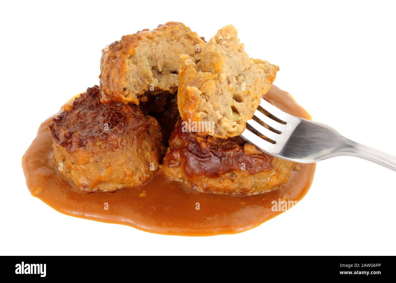 Pork faggots and gravy isolated on a white background Stock Photo - Alamy