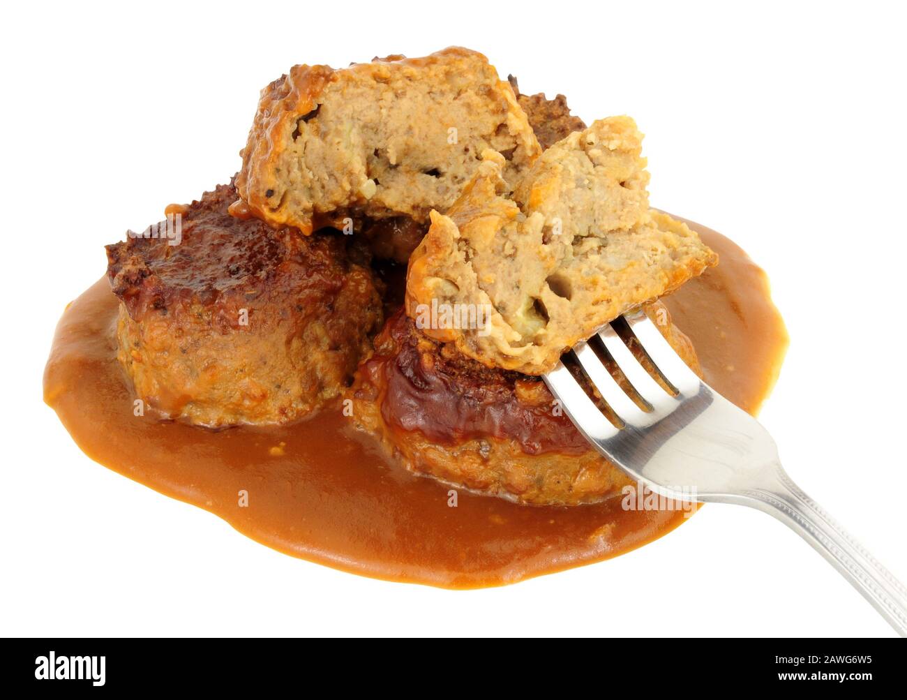 Pork faggots and gravy isolated on a white background Stock Photo - Alamy