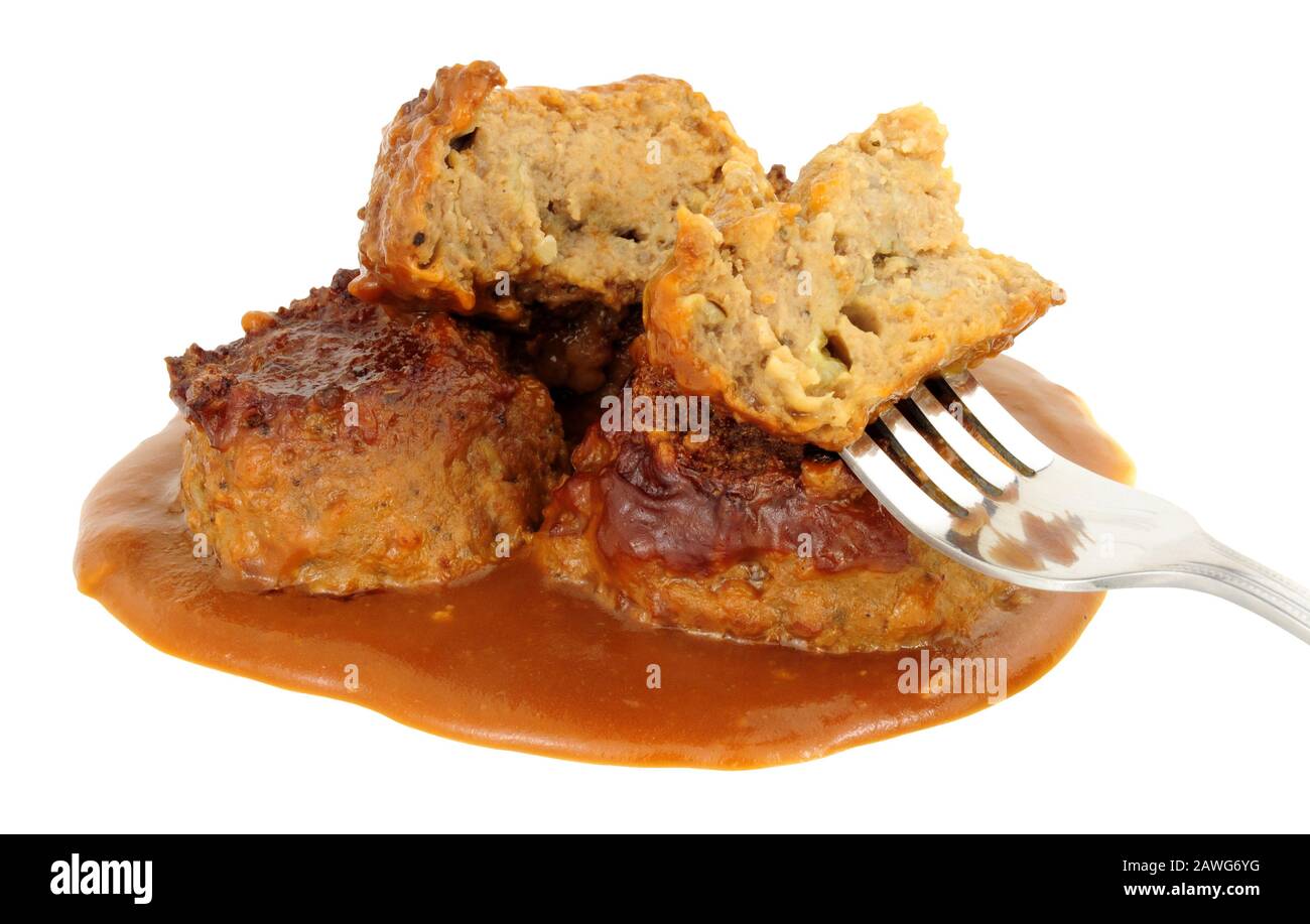 Pork faggots and gravy isolated on a white background Stock Photo - Alamy