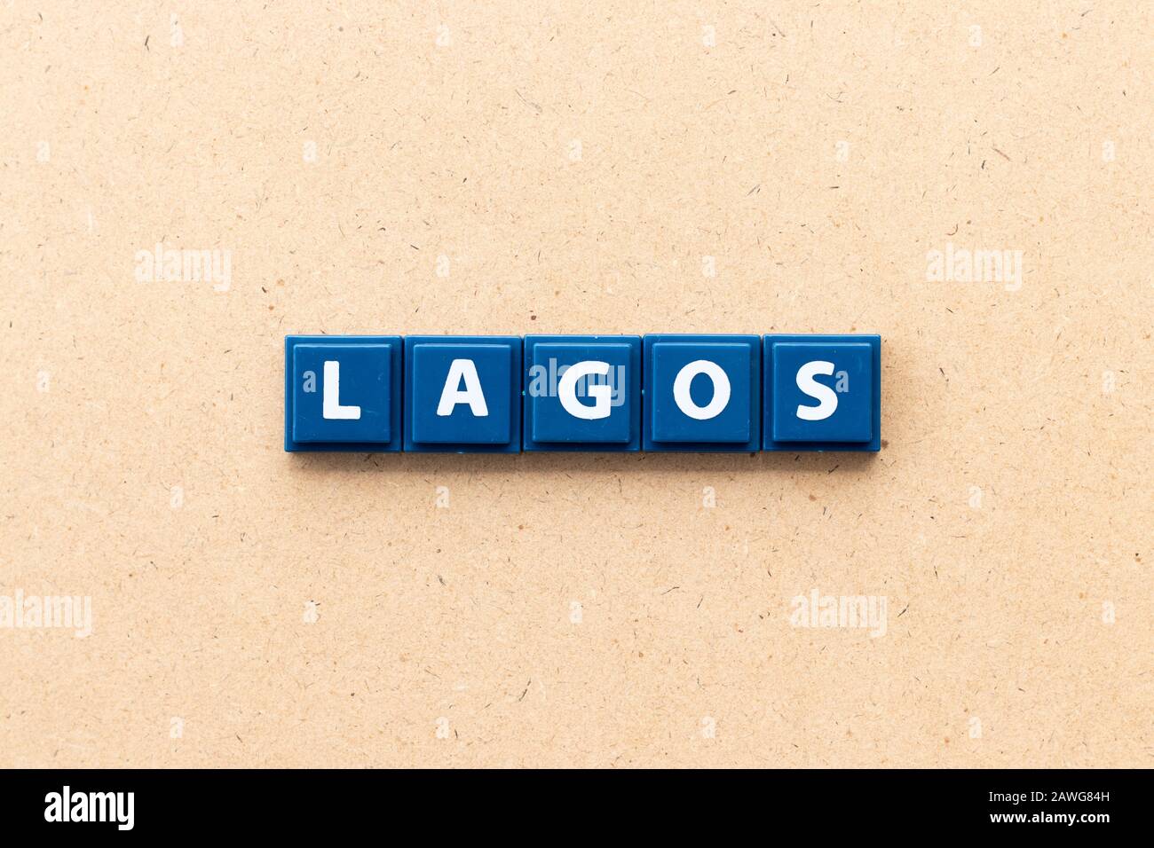 Tile letter in word Lagos on wood background Stock Photo - Alamy