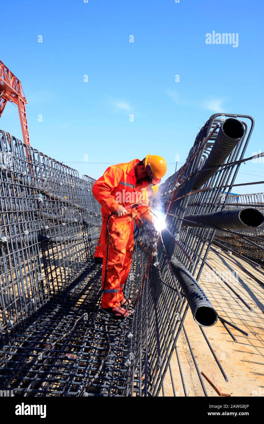 In the construction site, the welding workers at work Stock Photo - Alamy