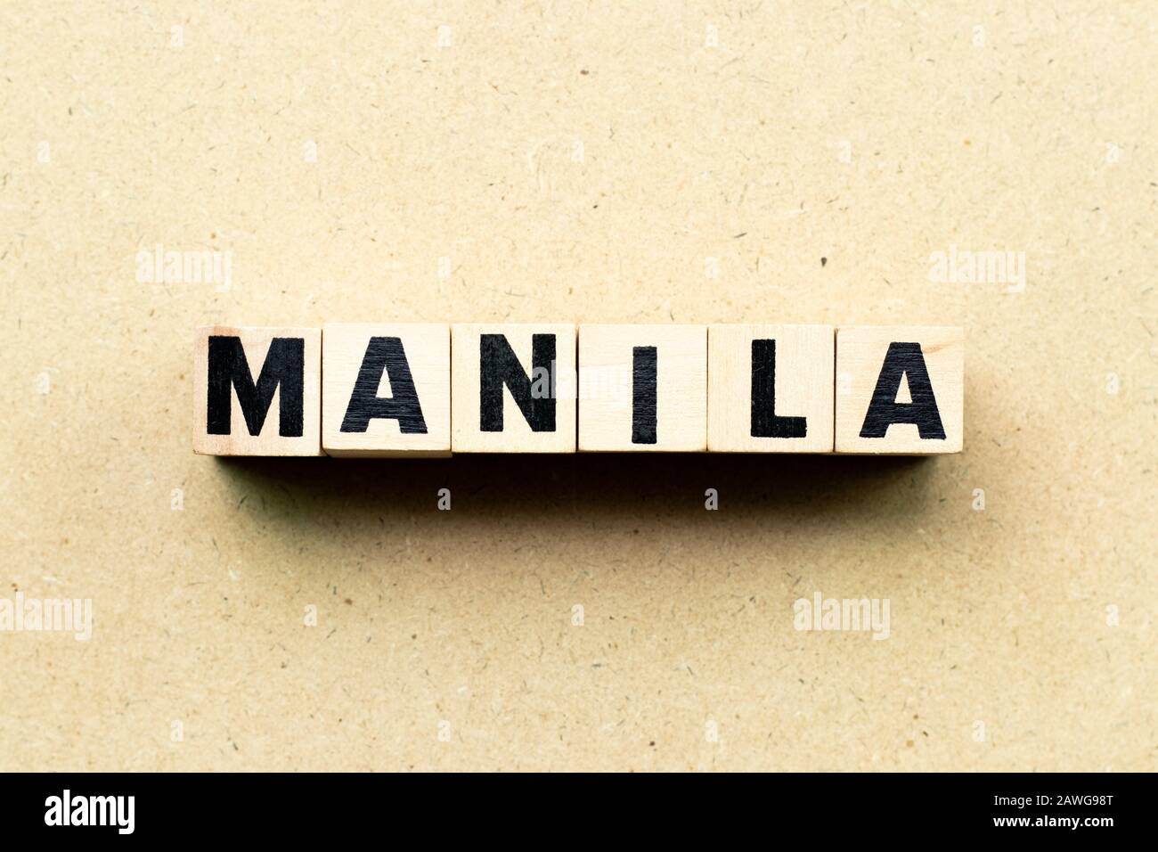 Letter block in word Manila on wood background Stock Photo - Alamy