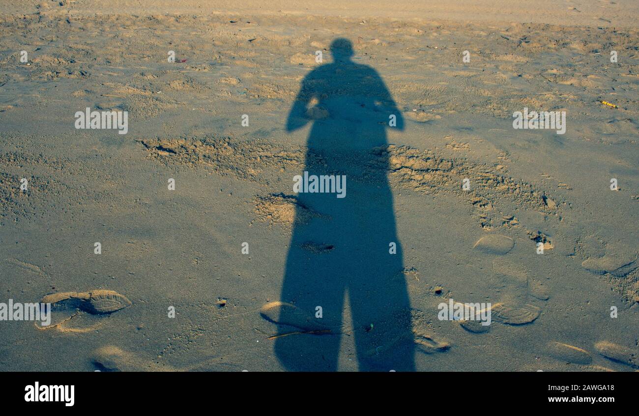 Person shadows with reflection on the ground Stock Photo - Alamy