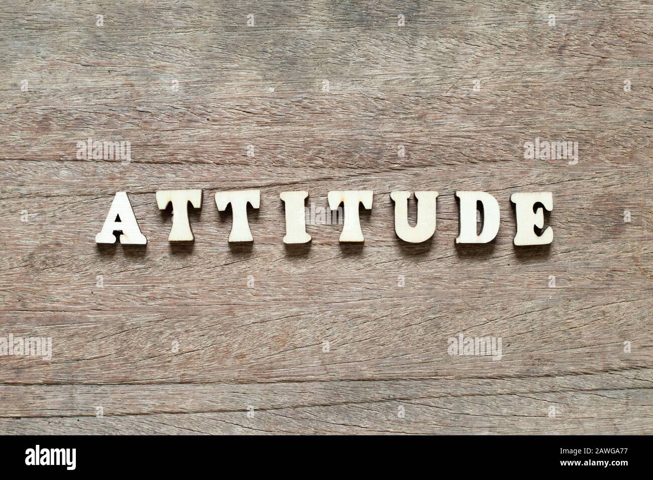 Letter block in word attitude on wood background Stock Photo - Alamy