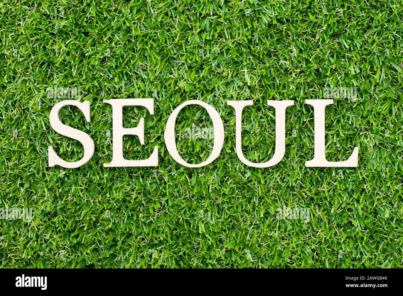 Wood alphabet letter in word Seoul on green grass background Stock ...