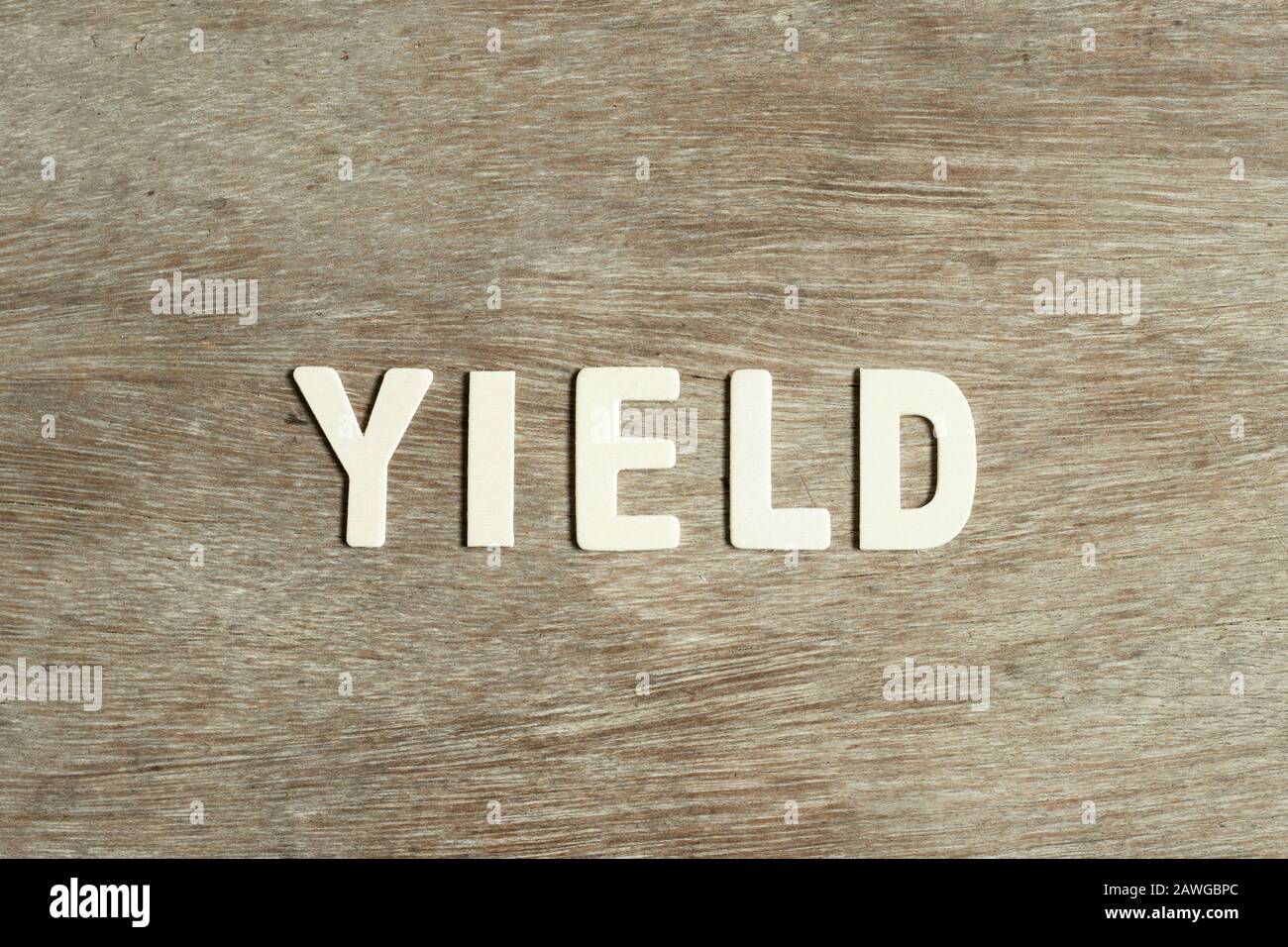 Alphabet letter in word yield on wood background Stock Photo - Alamy