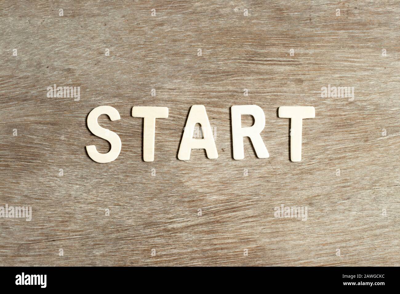 Alphabet letter in word start on wood background Stock Photo - Alamy