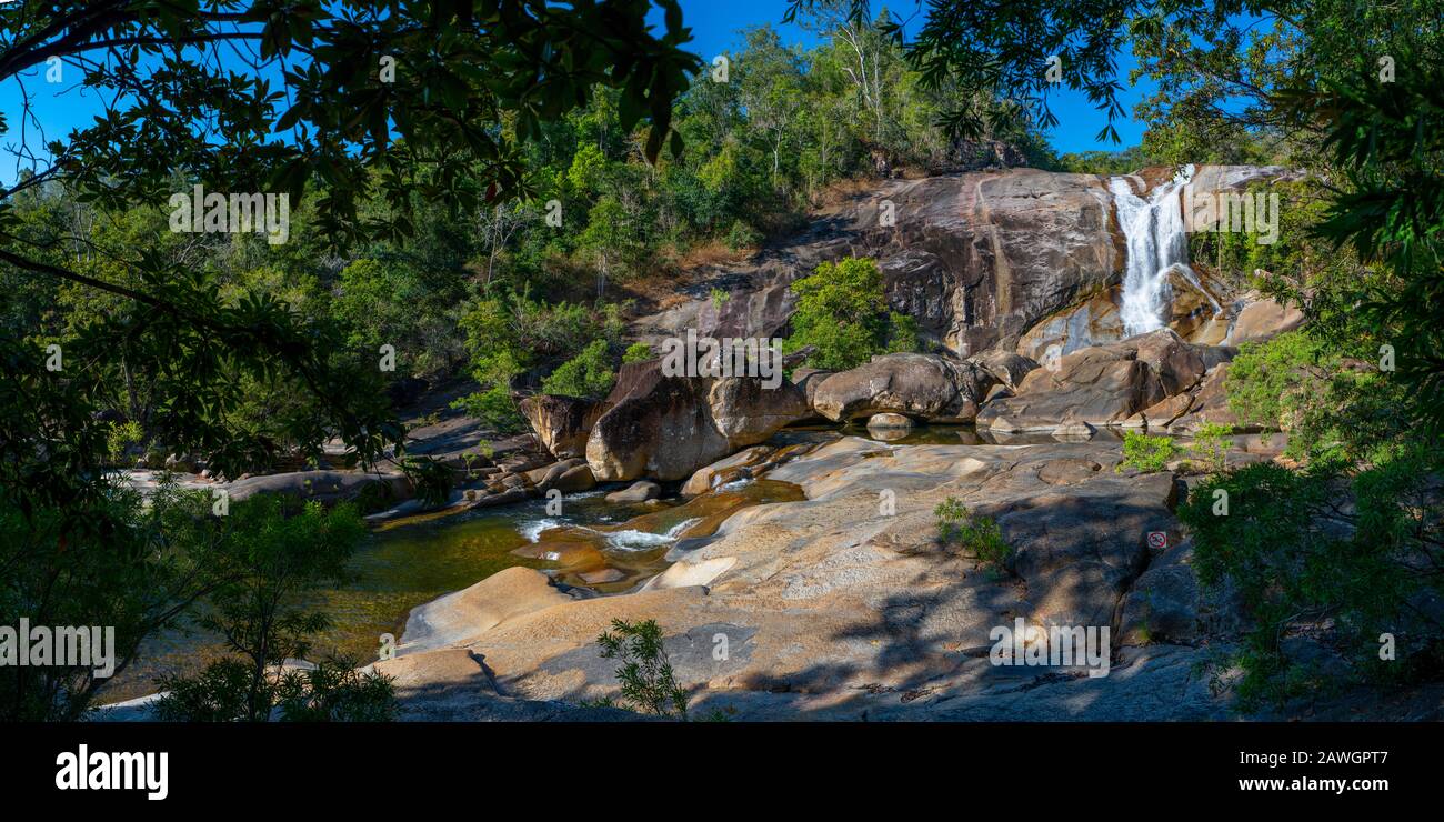 Murray Falls spilling over pink granite rock shelf. Girramay National ...