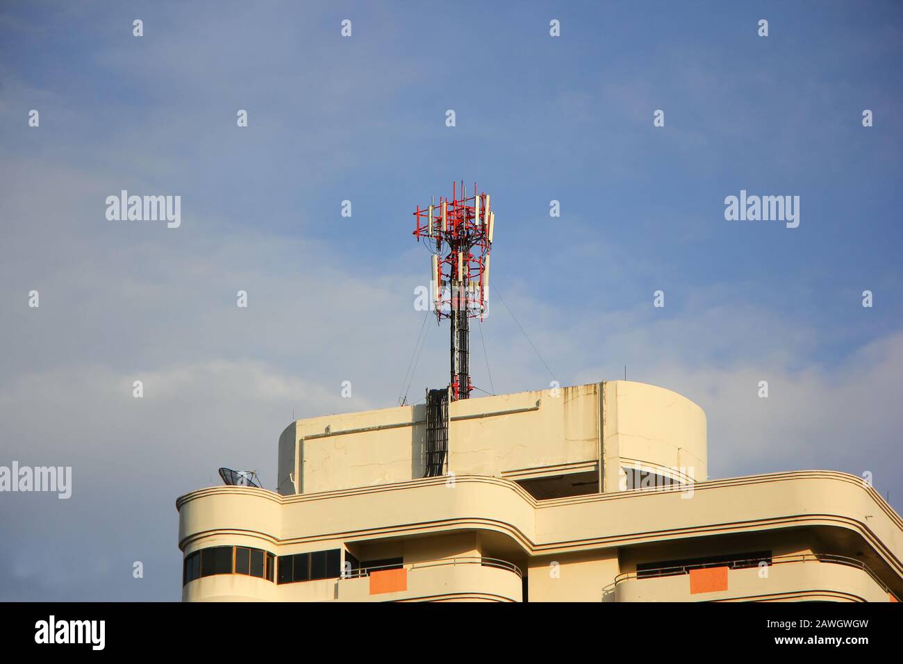 Mobile phone tower on building Stock Photo - Alamy