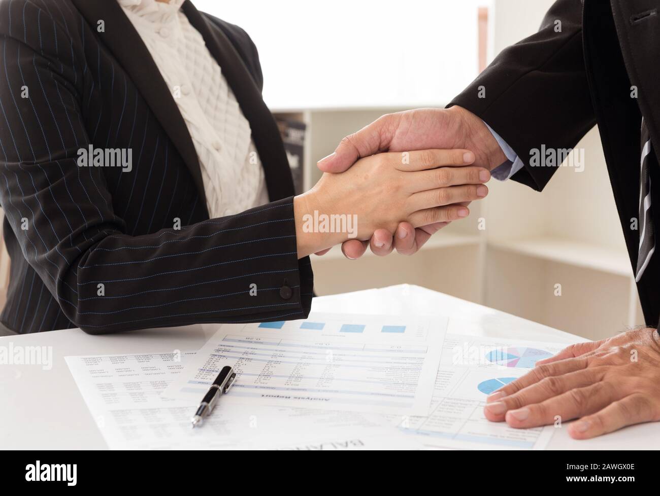 Image of handshake between colleague to work together to achieve the ...