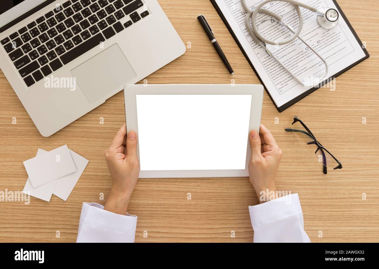 Doctors use tablets to search for patient data. view from above. Free ...