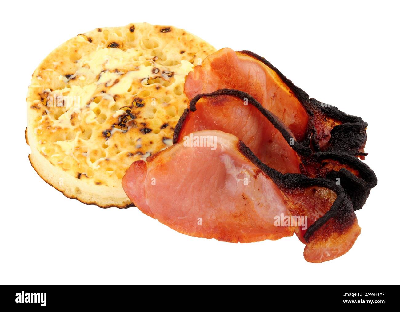 Smoked back bacon rashers on a large English crumpet isolated on a ...