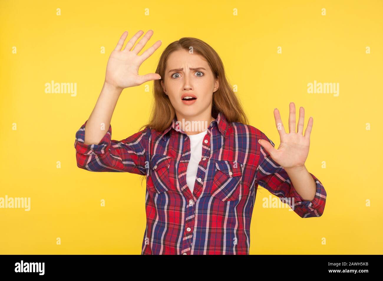 I'm afraid! Portrait of scared panicked ginger girl in checkered shirt ...