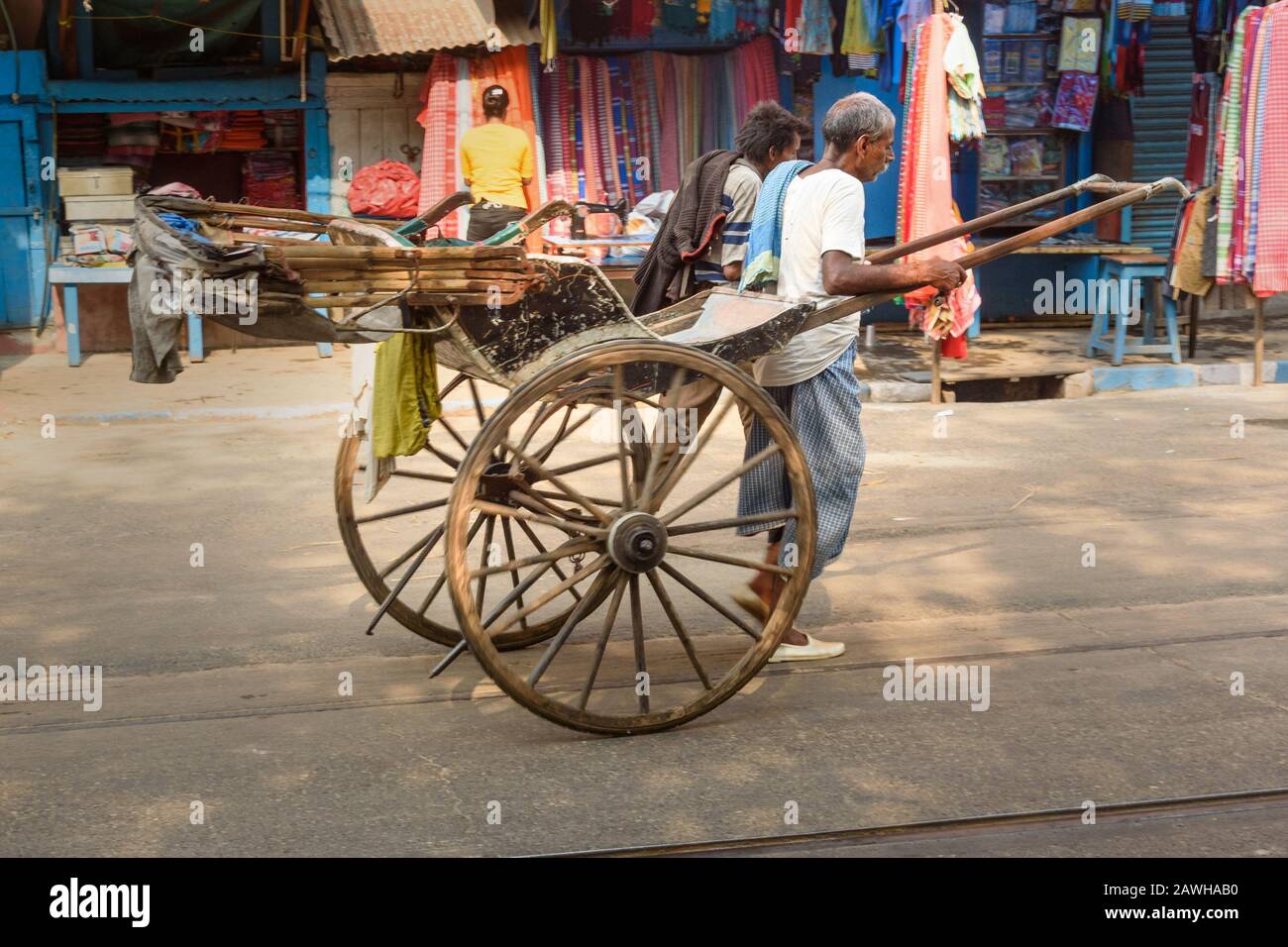 Hand pulling rickshaw puller pulling hi-res stock photography and ...