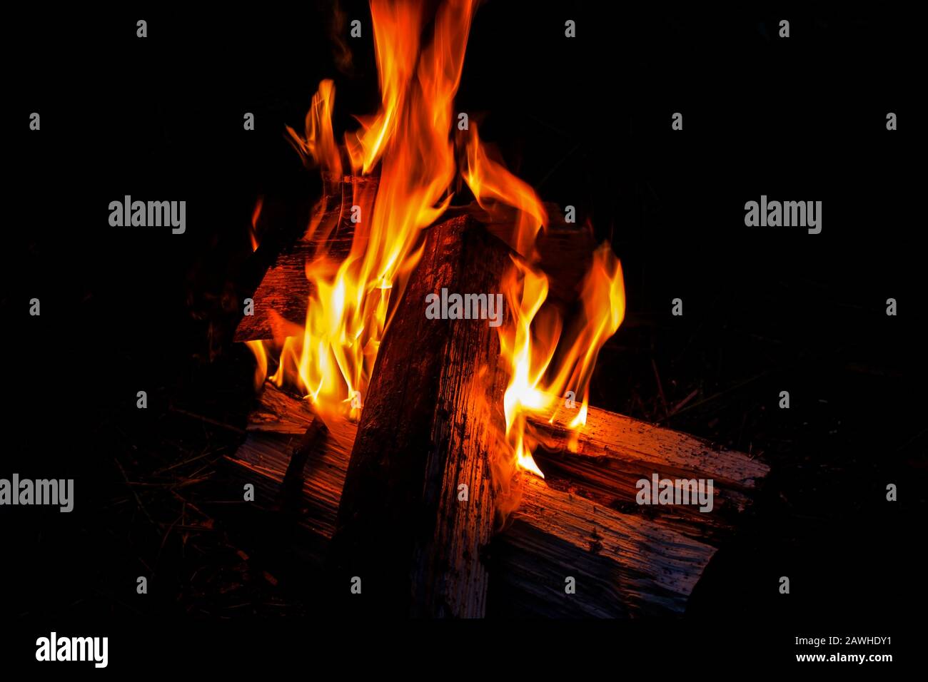 The bonfire burns at night in the dark Stock Photo - Alamy