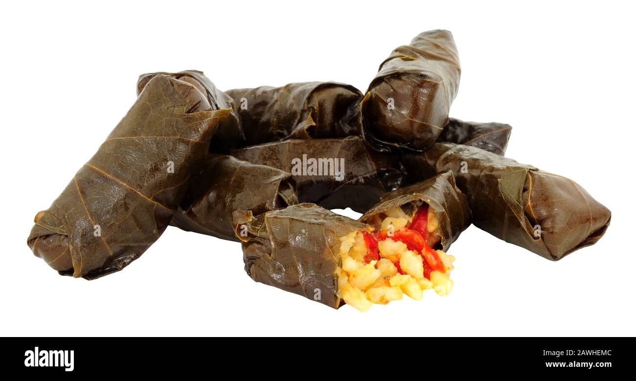 Rice and red pepper filled vine leaves isolated on a white background ...