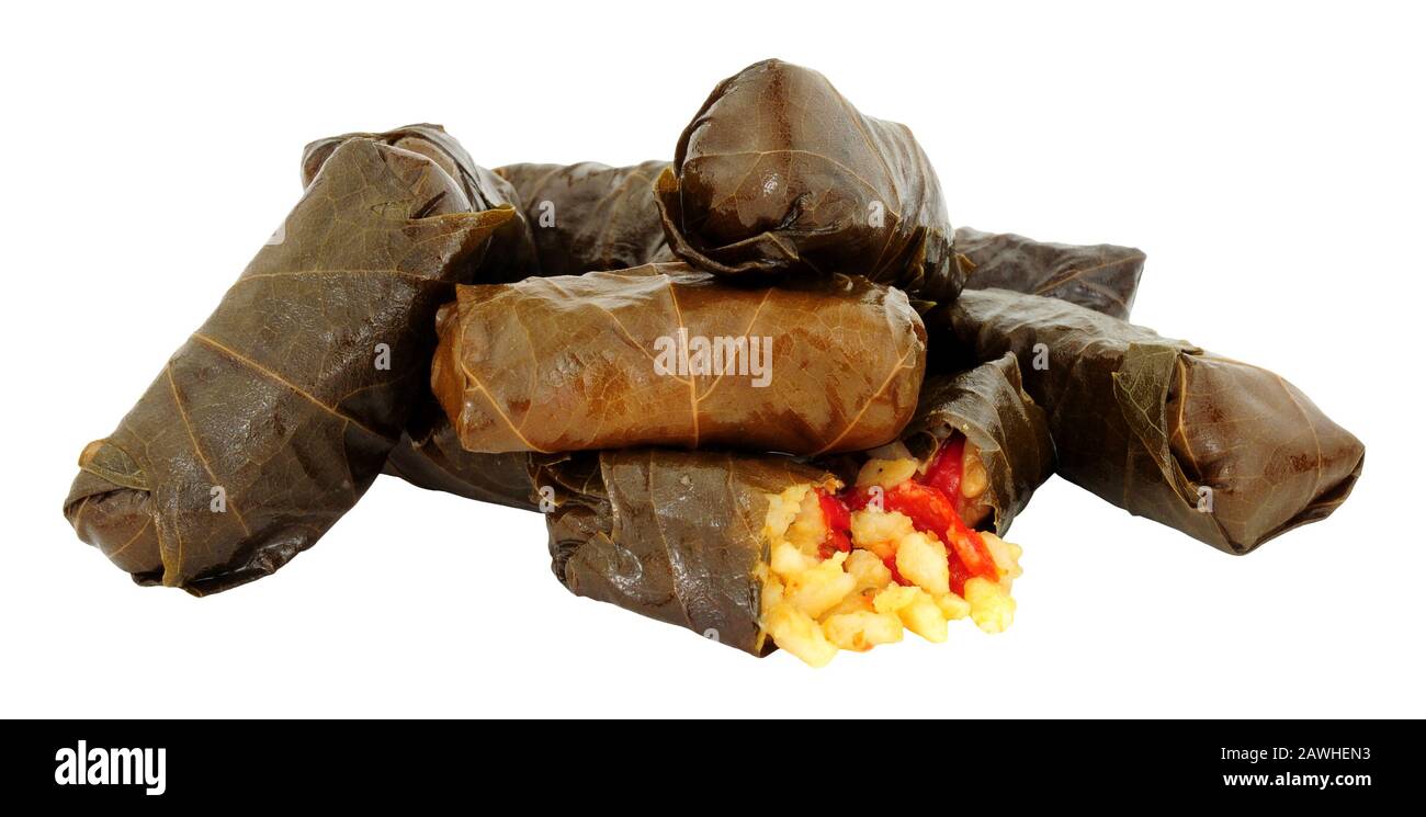 Rice and red pepper filled vine leaves isolated on a white background ...